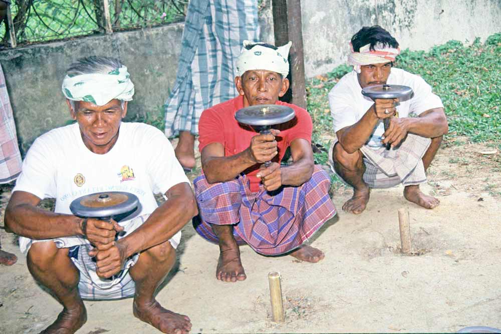 AsiaPhotoStock, malay men spinning tops
